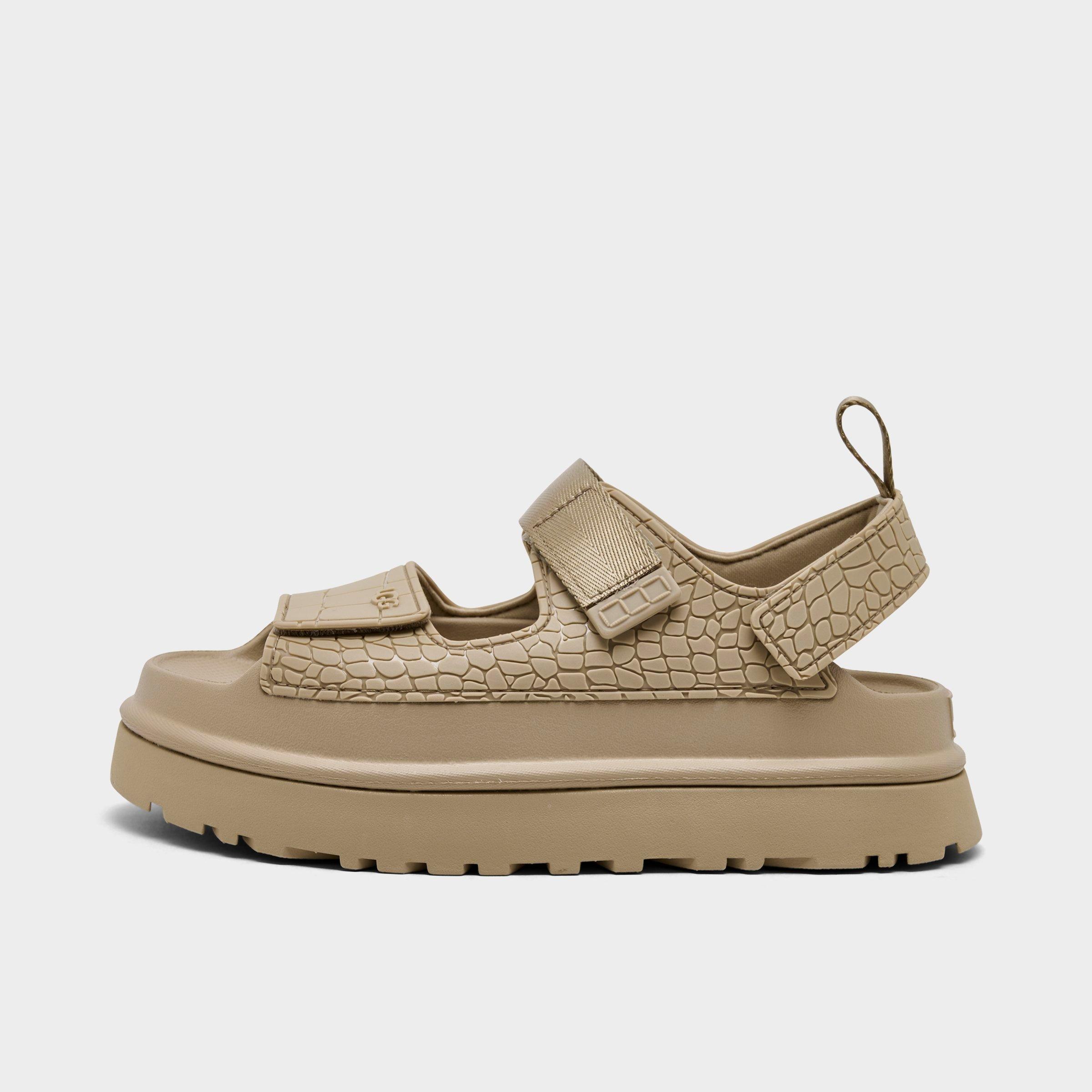 Click here for UGG Womens GoldenGlow Embossed Slide Sandals in Mu... prices