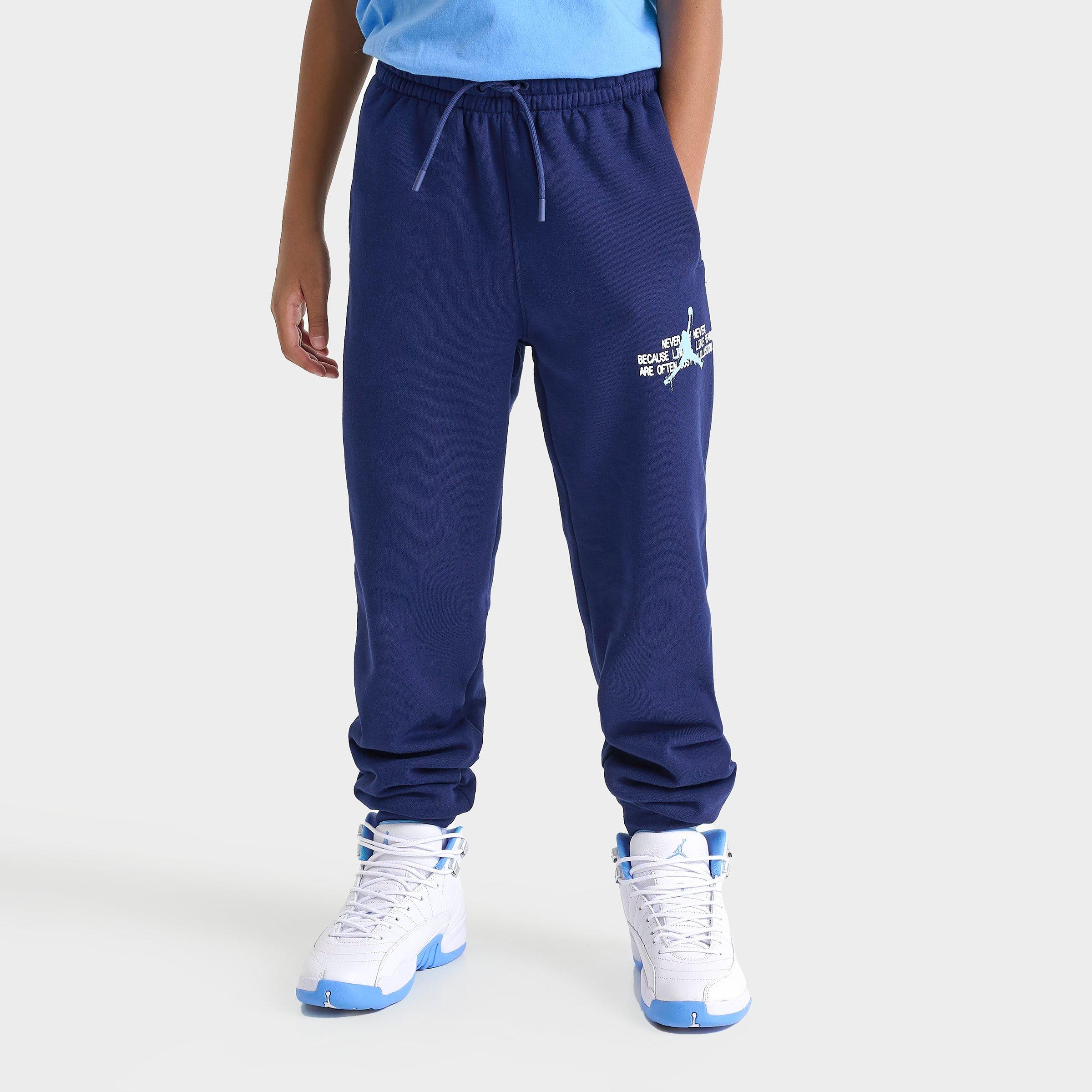Click here for Jordan Big Kids Jumpman Stamp Jogger Pants in Blue... prices