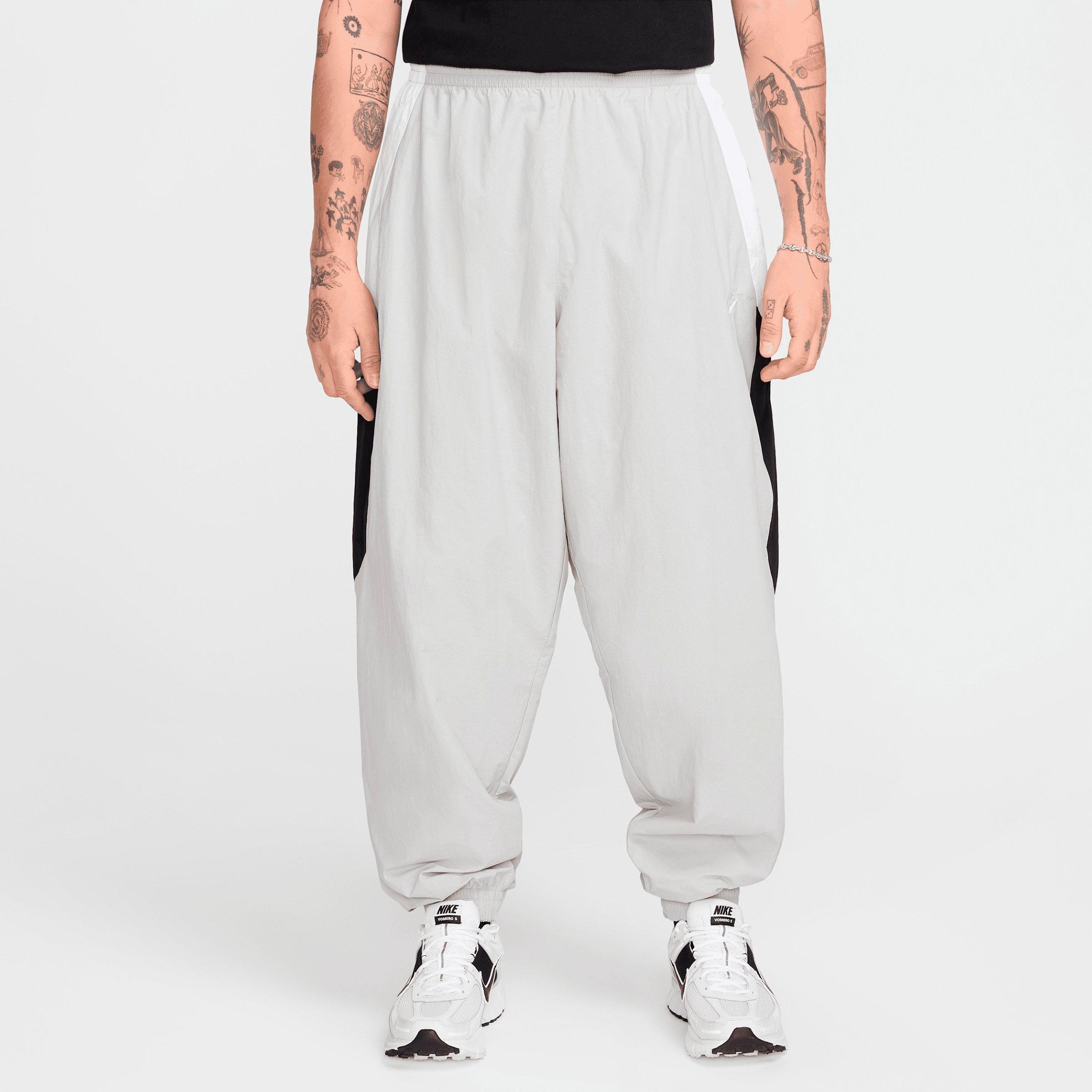 Click here for Nike Mens Club Oversized Woven Track Pants in Ligh... prices