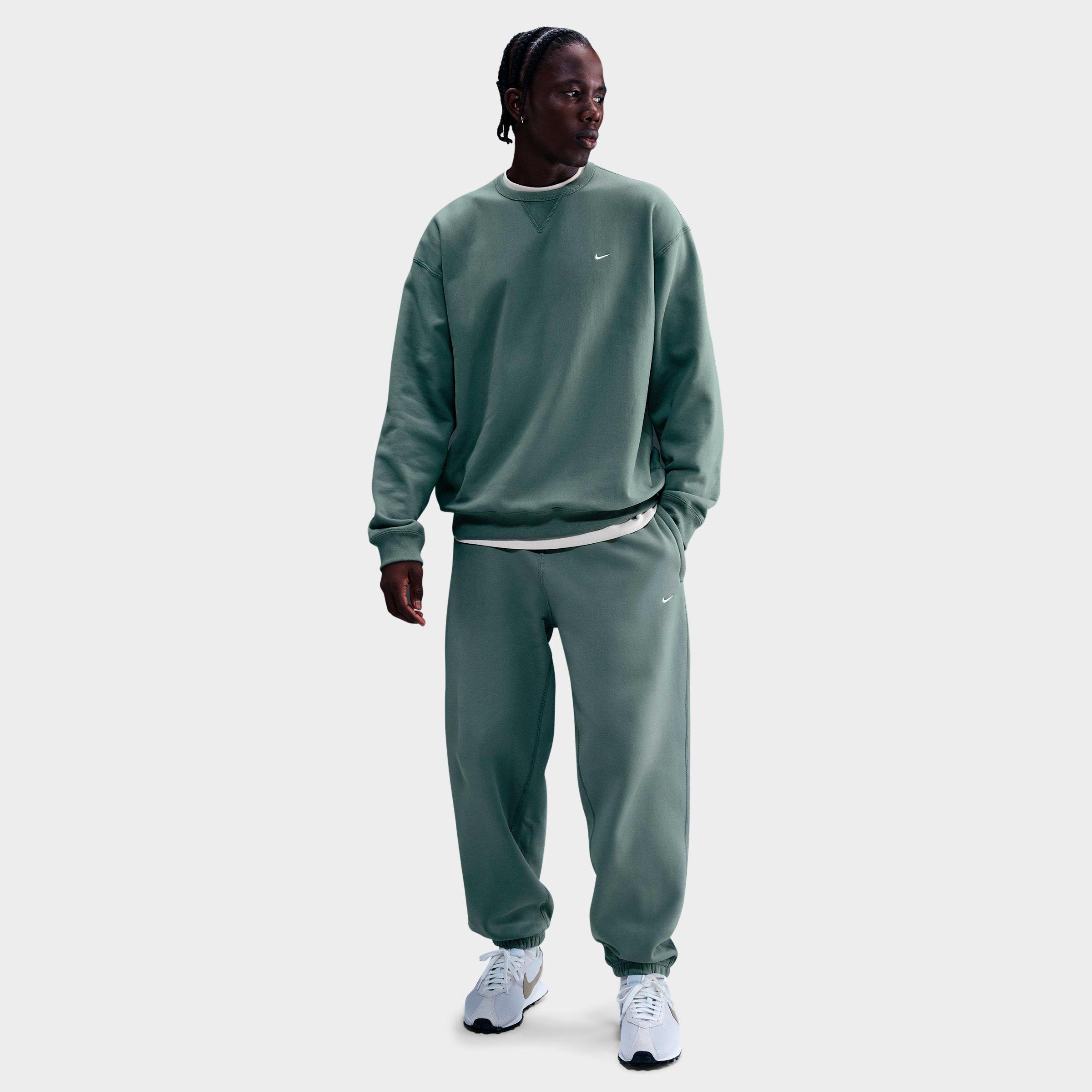 Click here for Nike Mens Solo Swoosh Cuffed Fleece Pants in Clay... prices