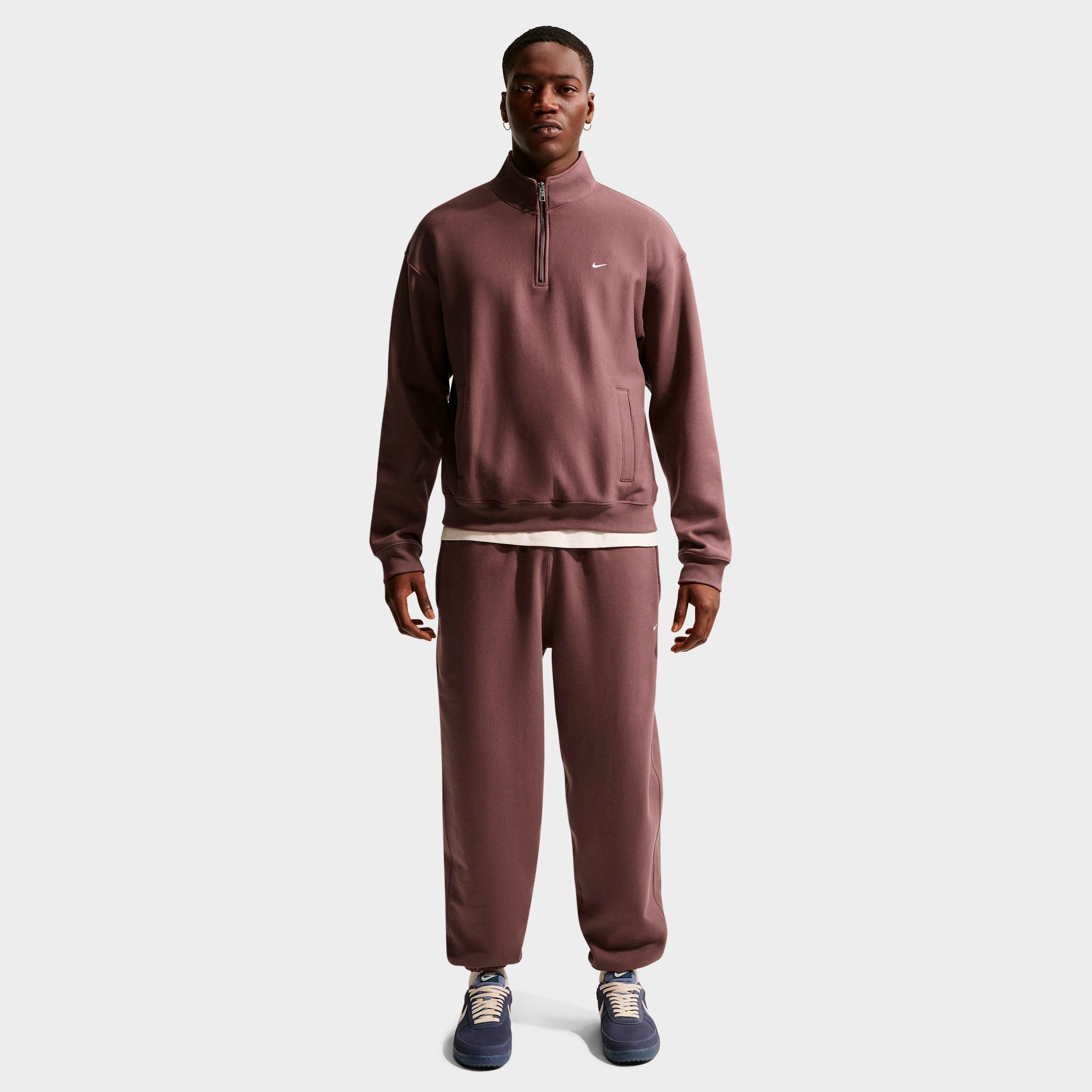Click here for Nike Mens Solo Swoosh Cuffed Fleece Pants in Tatto... prices