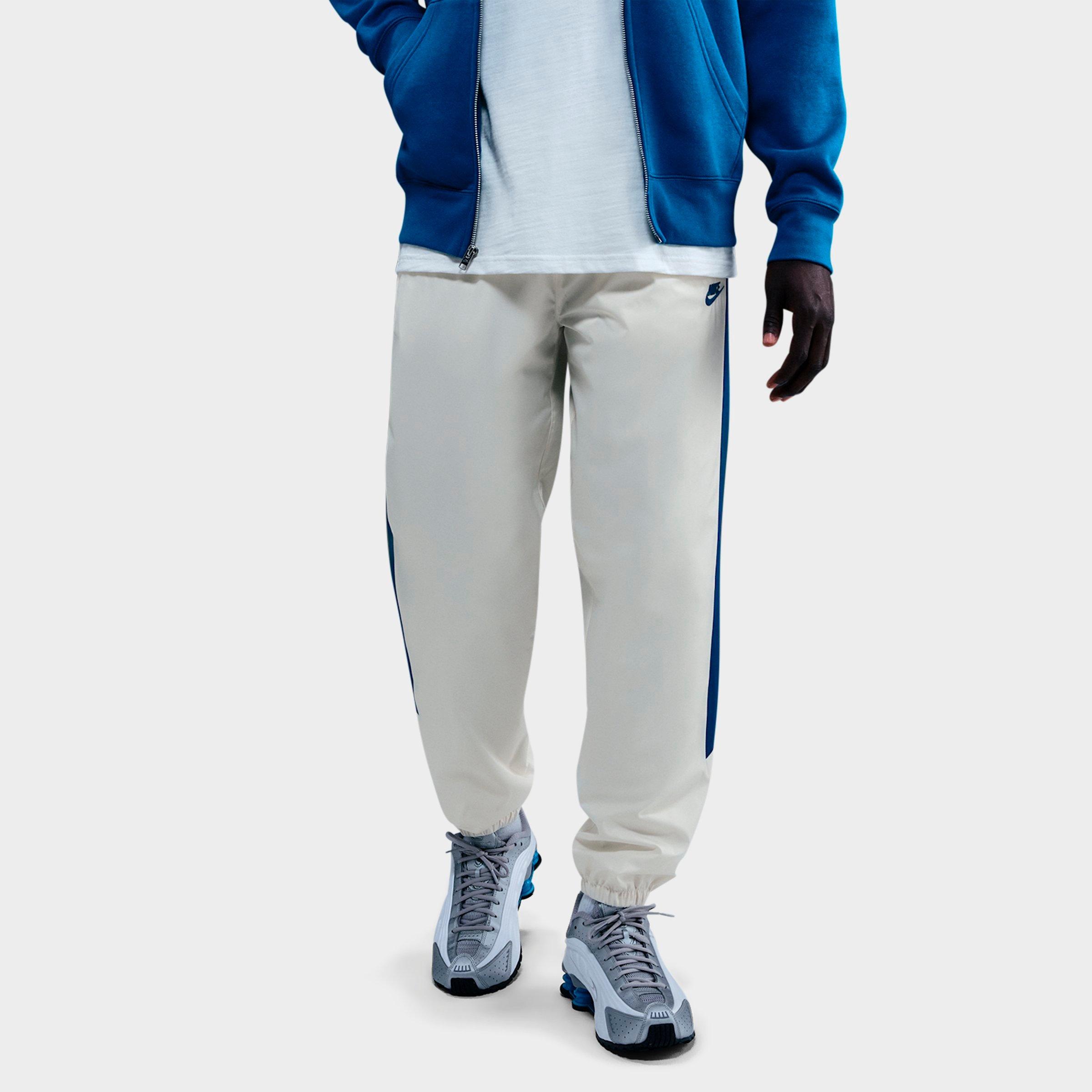 Click here for Nike Mens Windrunner Lined Pants in Sail/Court Blu... prices