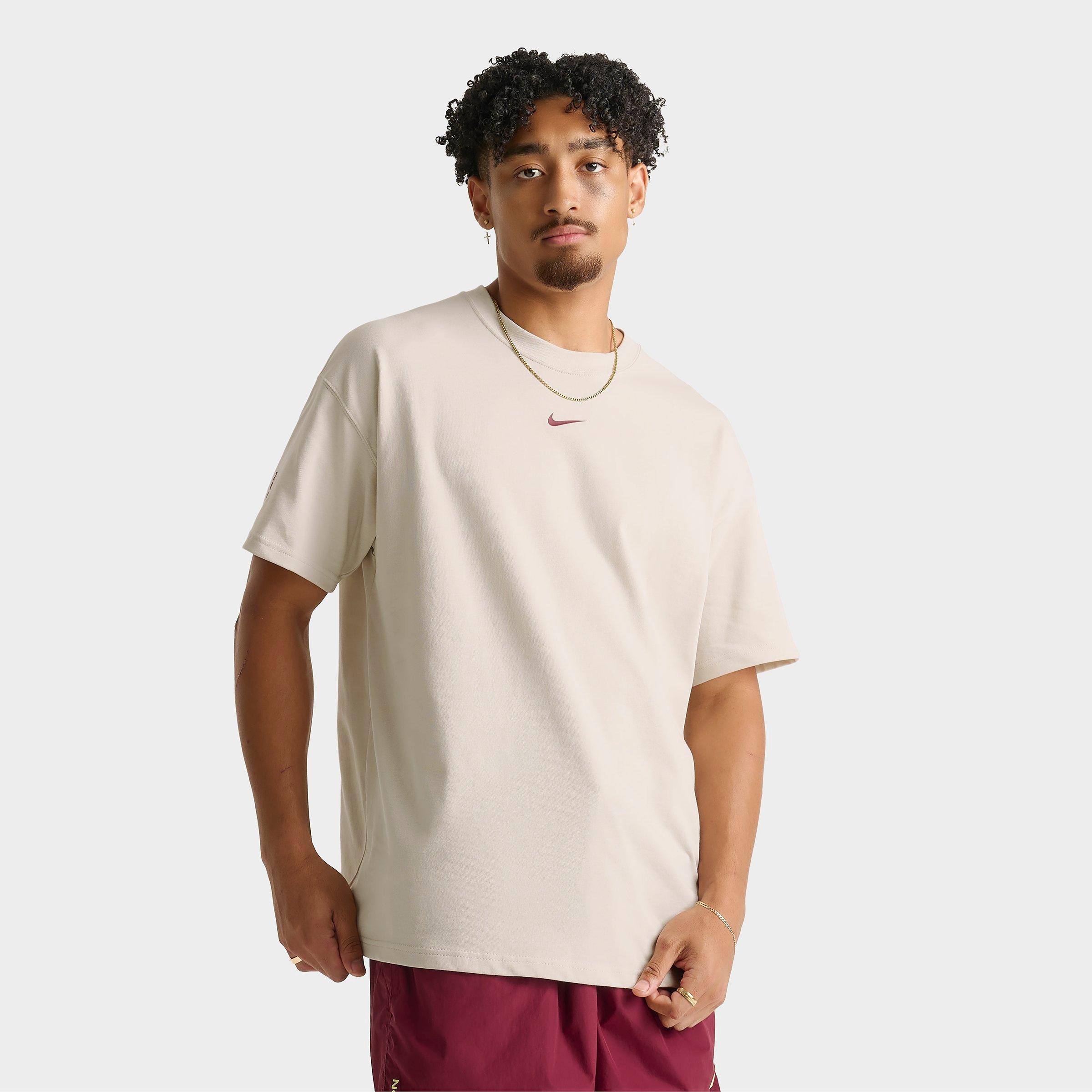 Click here for Nike Mens NOCTA NRG 2 T-Shirt in Light Orewood Bro... prices