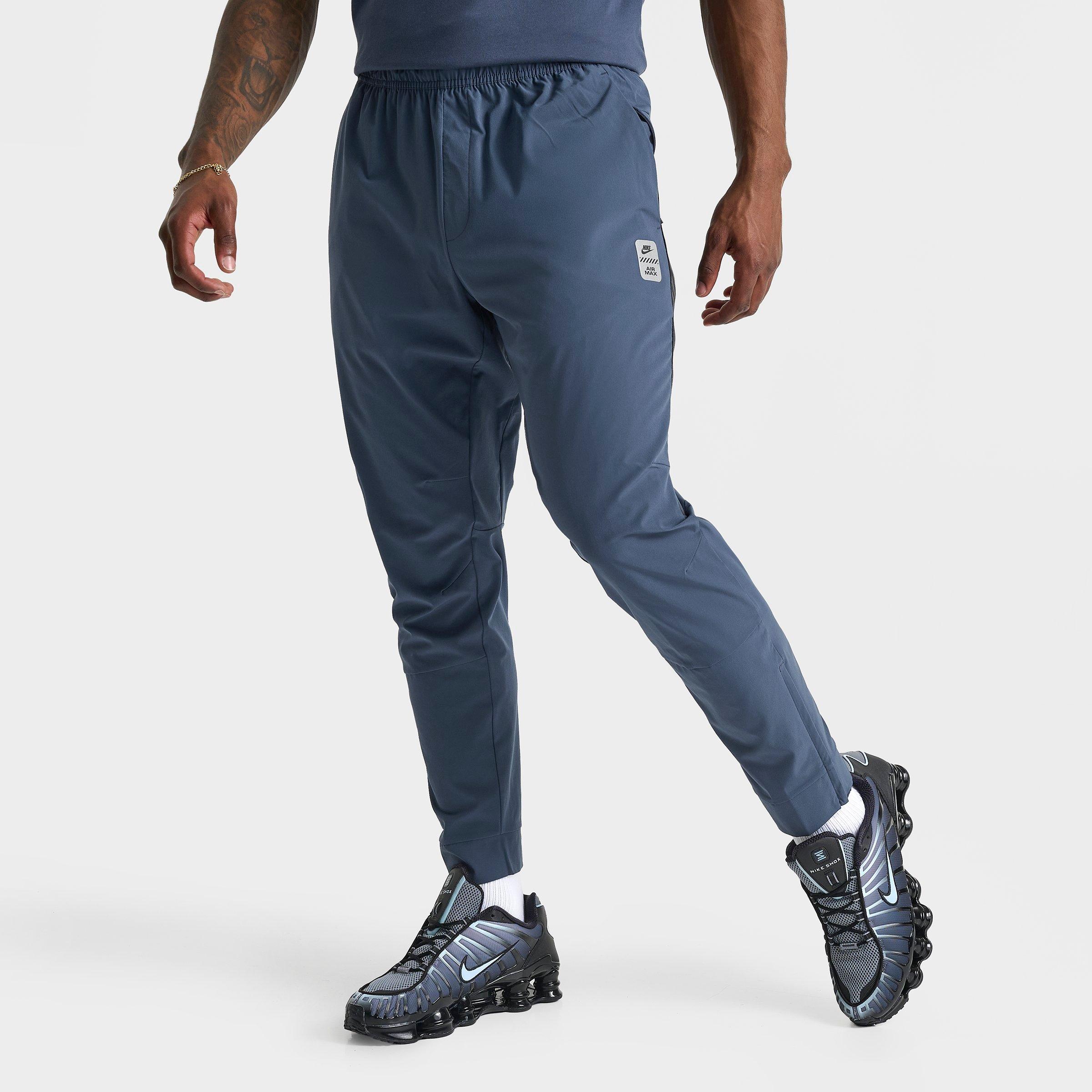 Click here for Nike Mens Air Max Stretch-Woven Pants in Thunder B... prices