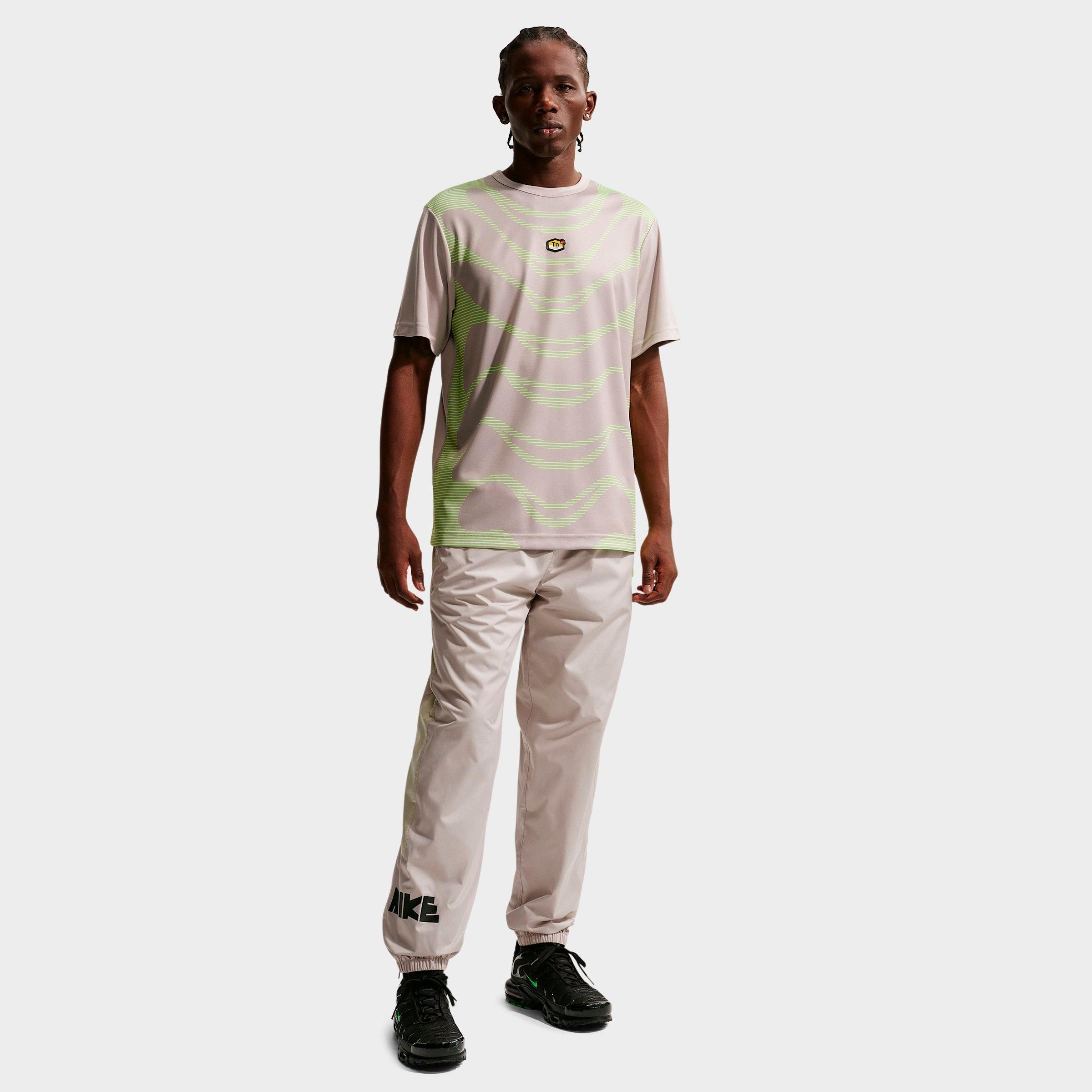 Click here for Nike Mens Windrunner Graphic Woven Pants in Moon P... prices