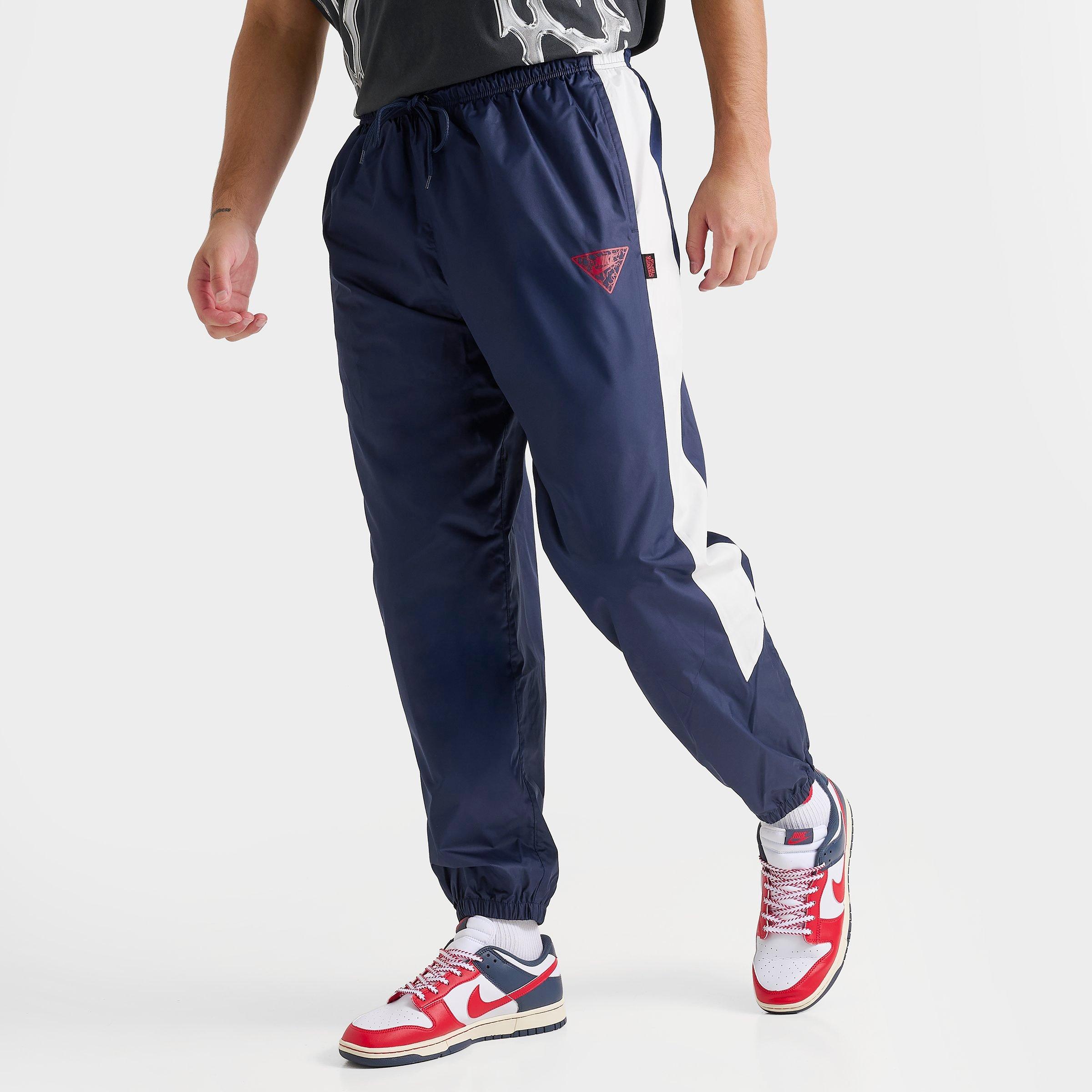 Click here for Nike Mens x Stranger Things NRG Woven Pants in Mid... prices