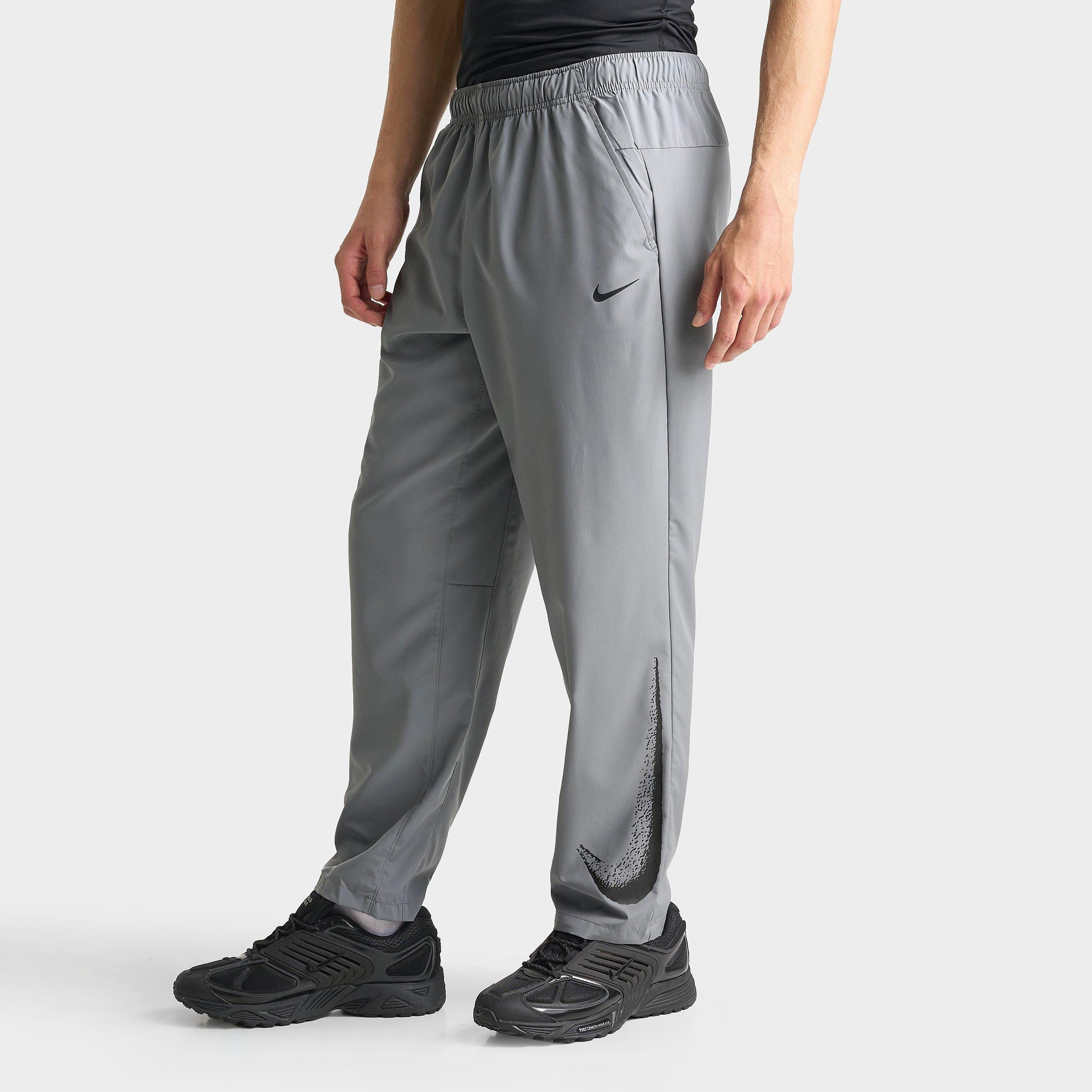 Click here for Nike Mens Dri-FIT Form Graphic Track Pants in Smok... prices
