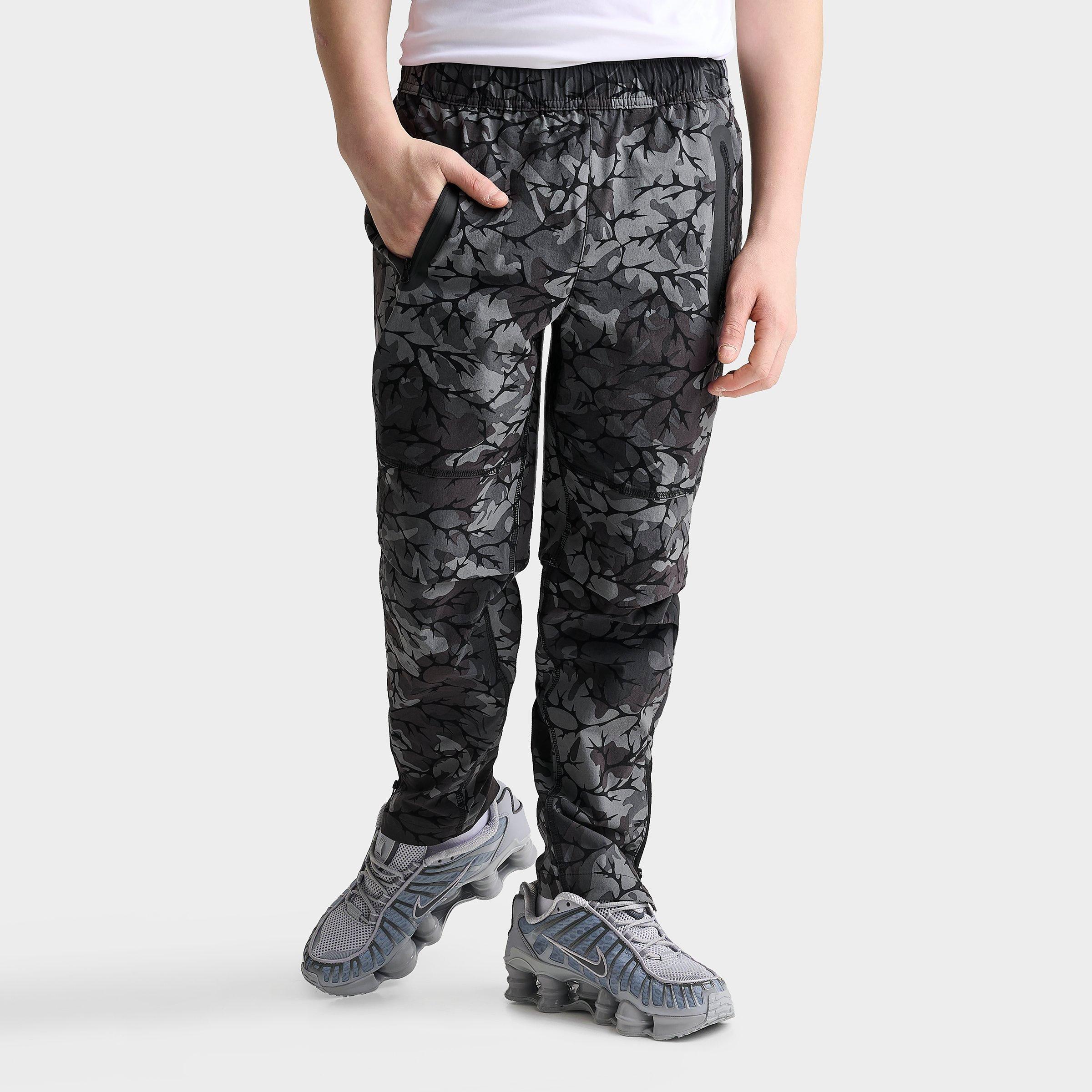 Click here for Nike Big Kids Sportswear Tech Woven Pants in Black... prices