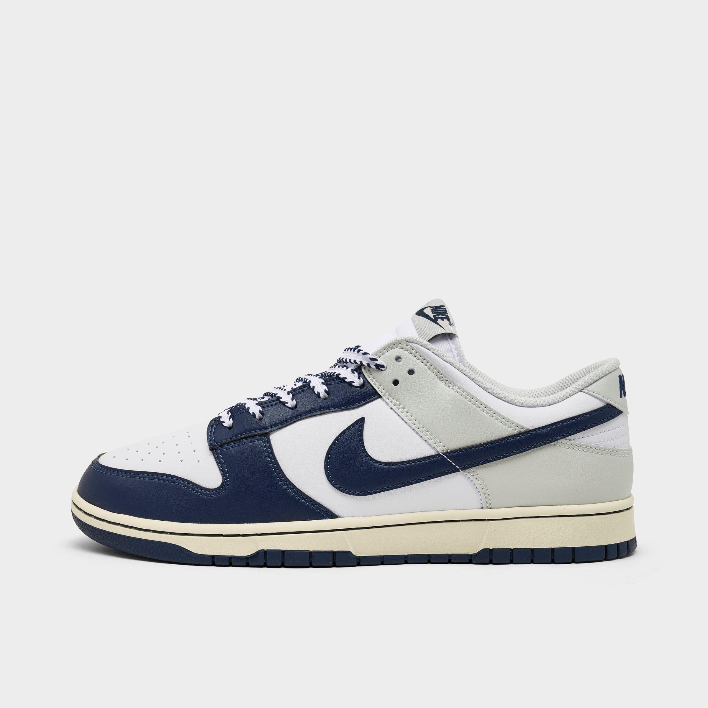 Click here for Nike Mens Dunk Low SE Casual Shoes in White/Midnig... prices