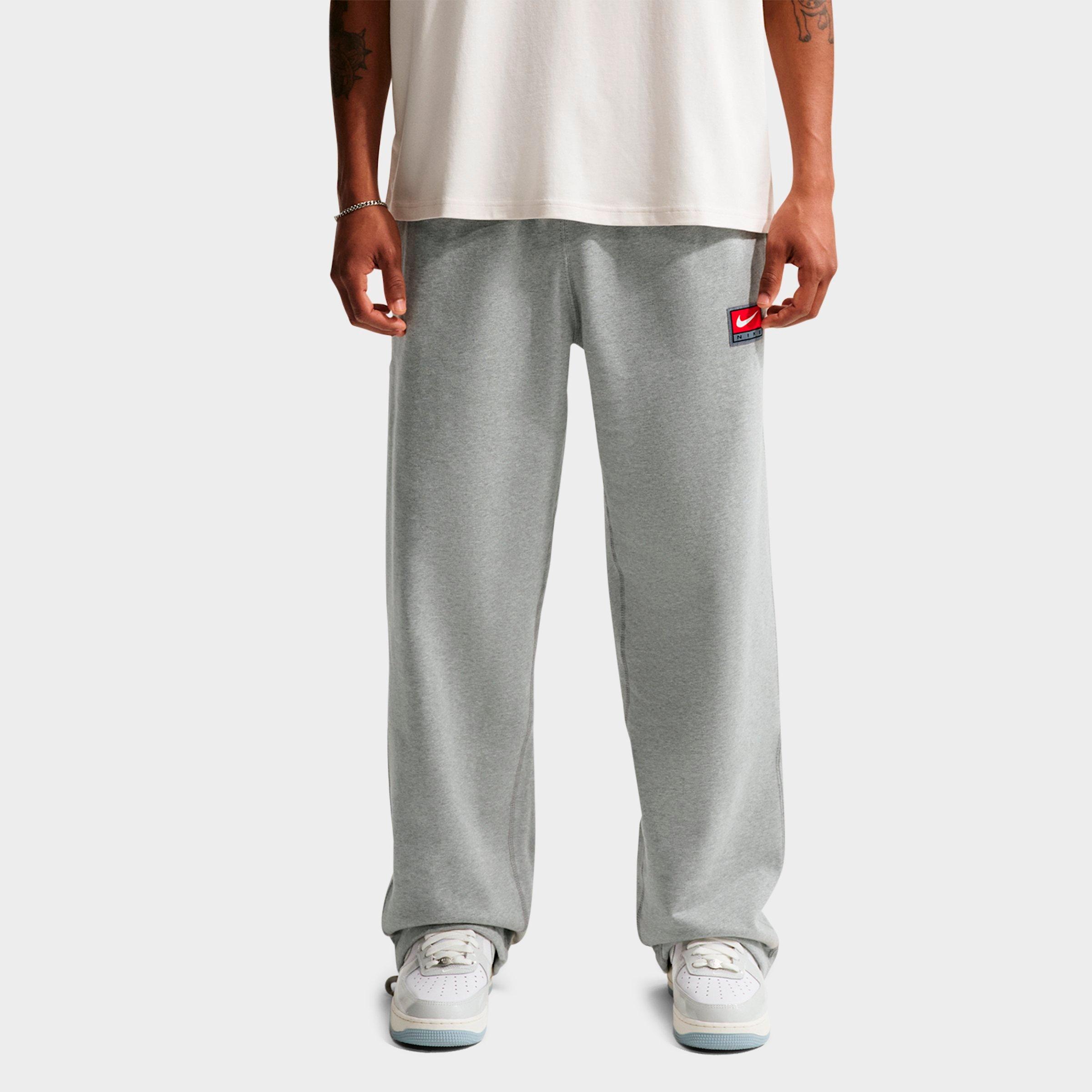 Click here for Nike Mens Solo Swoosh Fleece Open-Hem Pants in Dar... prices