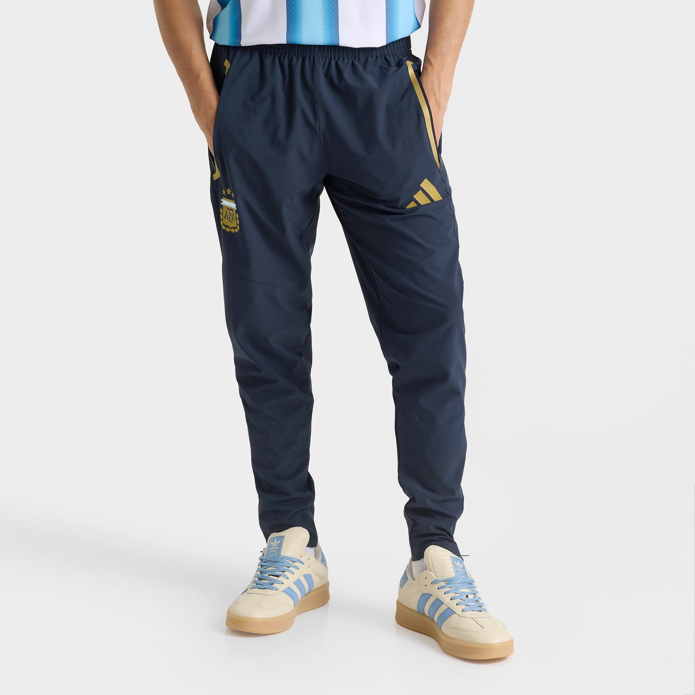 Click here for adidas Mens Argentina Tiro Travel Track Pants in N... prices