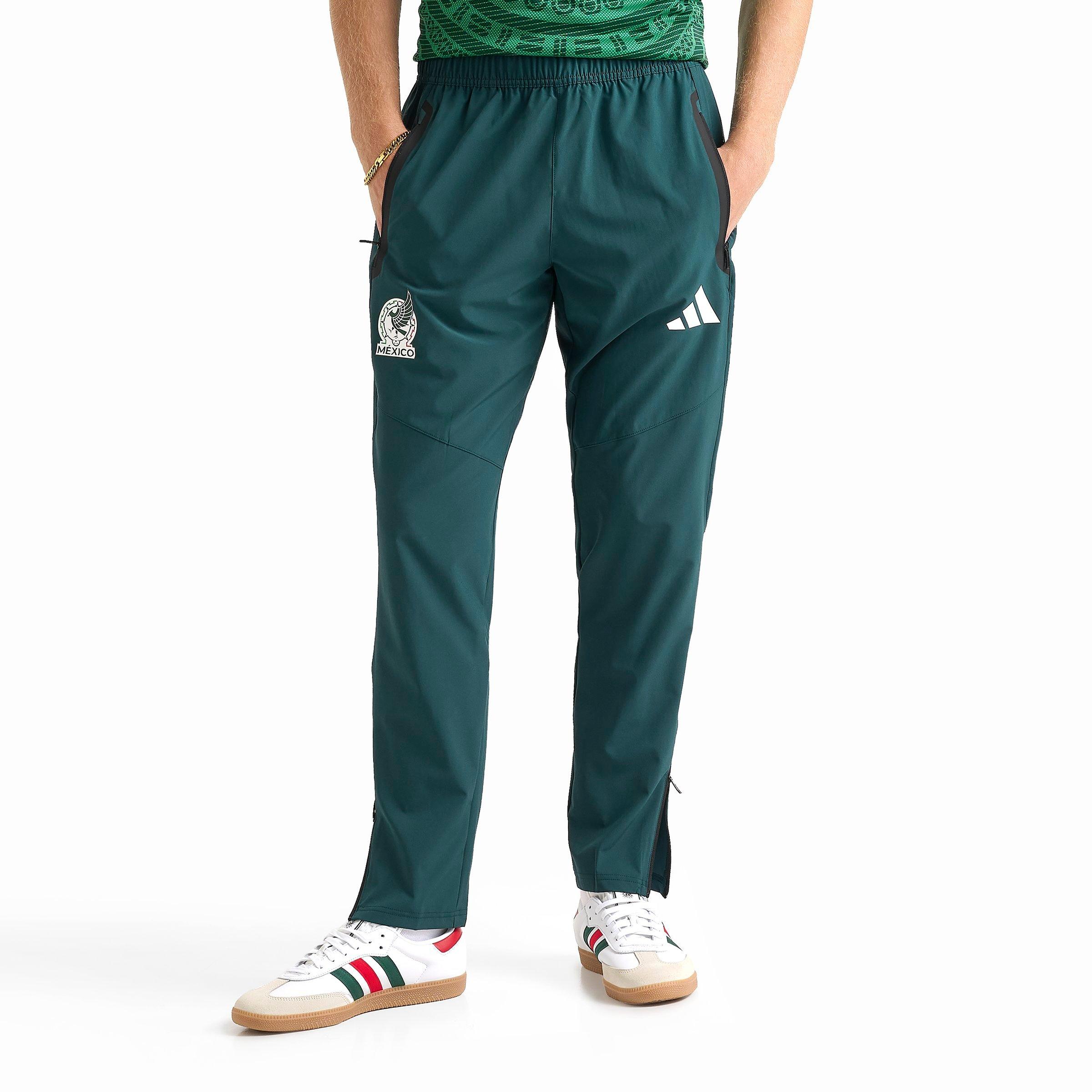 Click here for adidas Mens Mexico Tiro Travel Track Pants in Auro... prices