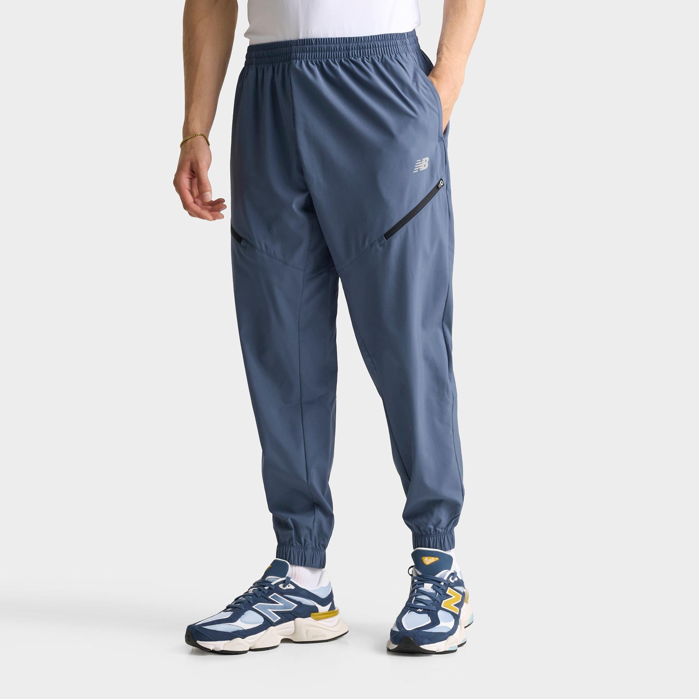 Click here for New Balance Mens Woven Zip Pocket Jogger Pants in... prices