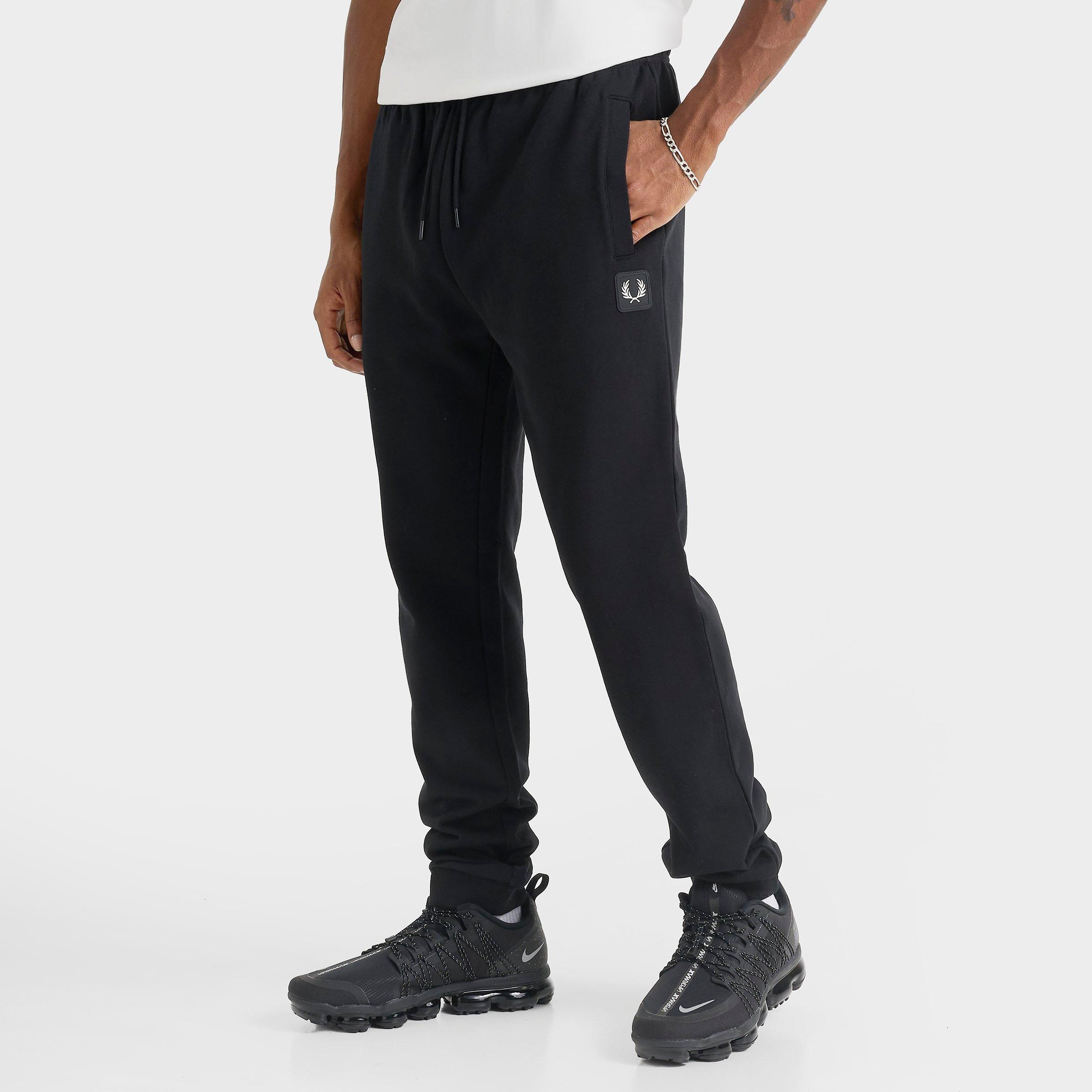 Click here for Fred Perry Mens Badge Loopback Sweatpants in Black... prices